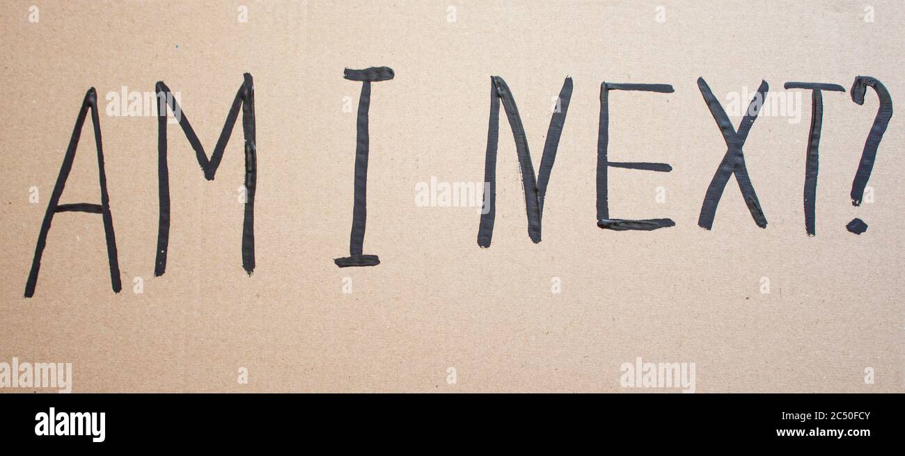 AM I NEXT. Text message for protest on cardboard. Stop racism. Police ...