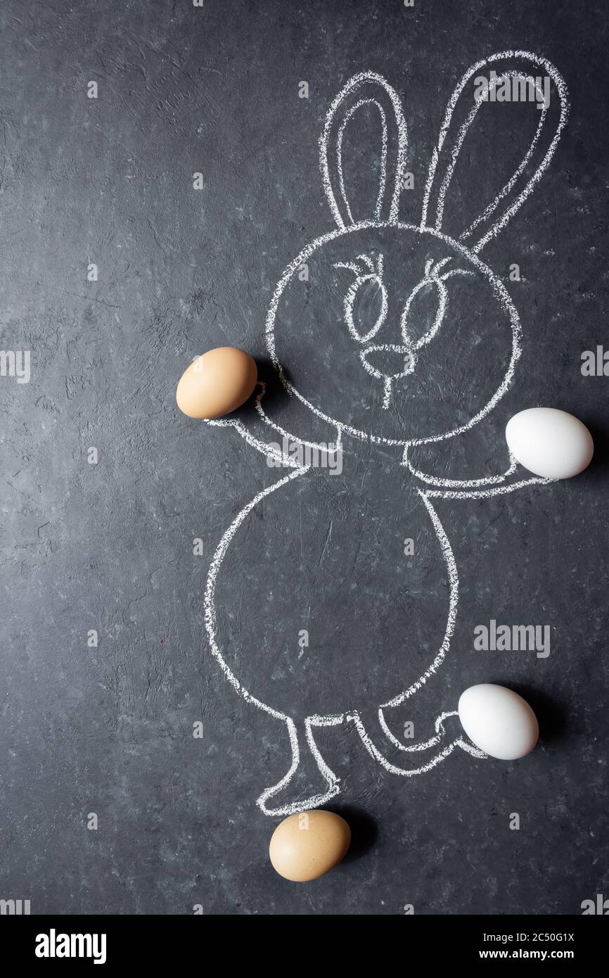 Easter bunny with eggs. Green grass and eggs. Chalk drawn bunny with ...