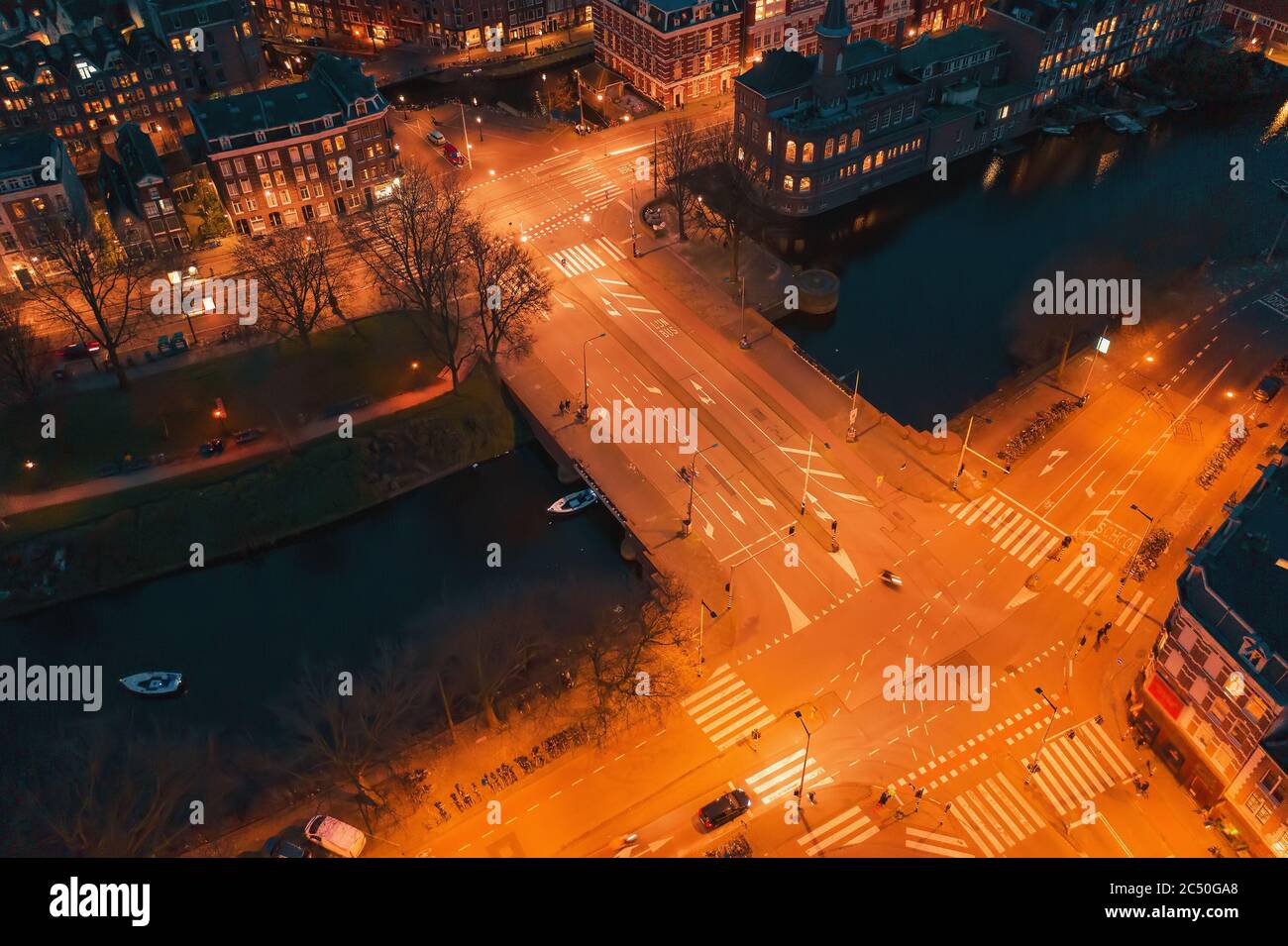 Aerial view of night Amsterdam city road intersection with bridge and ...