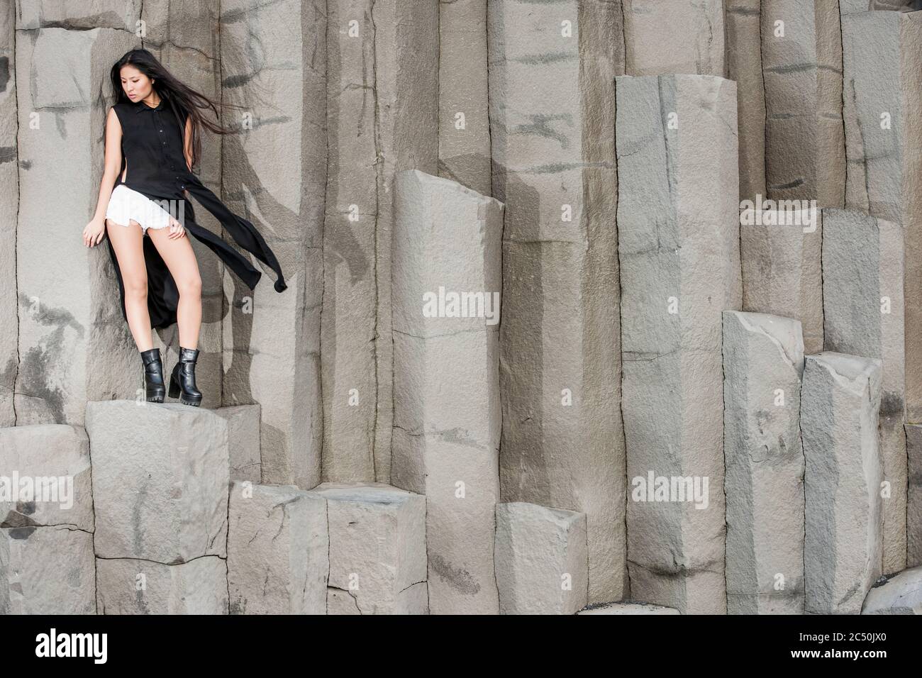 beautiful woman posing on basalt rocks in Iceland Stock Photo - Alamy