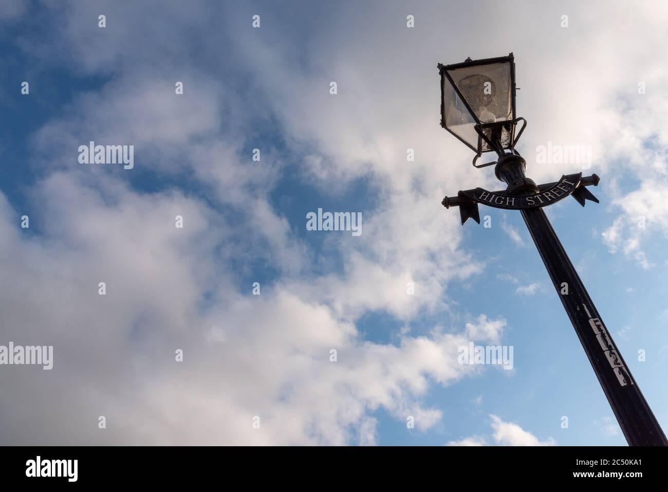 High street lamp post with a sign. English, Brittish Stock Photo - Alamy