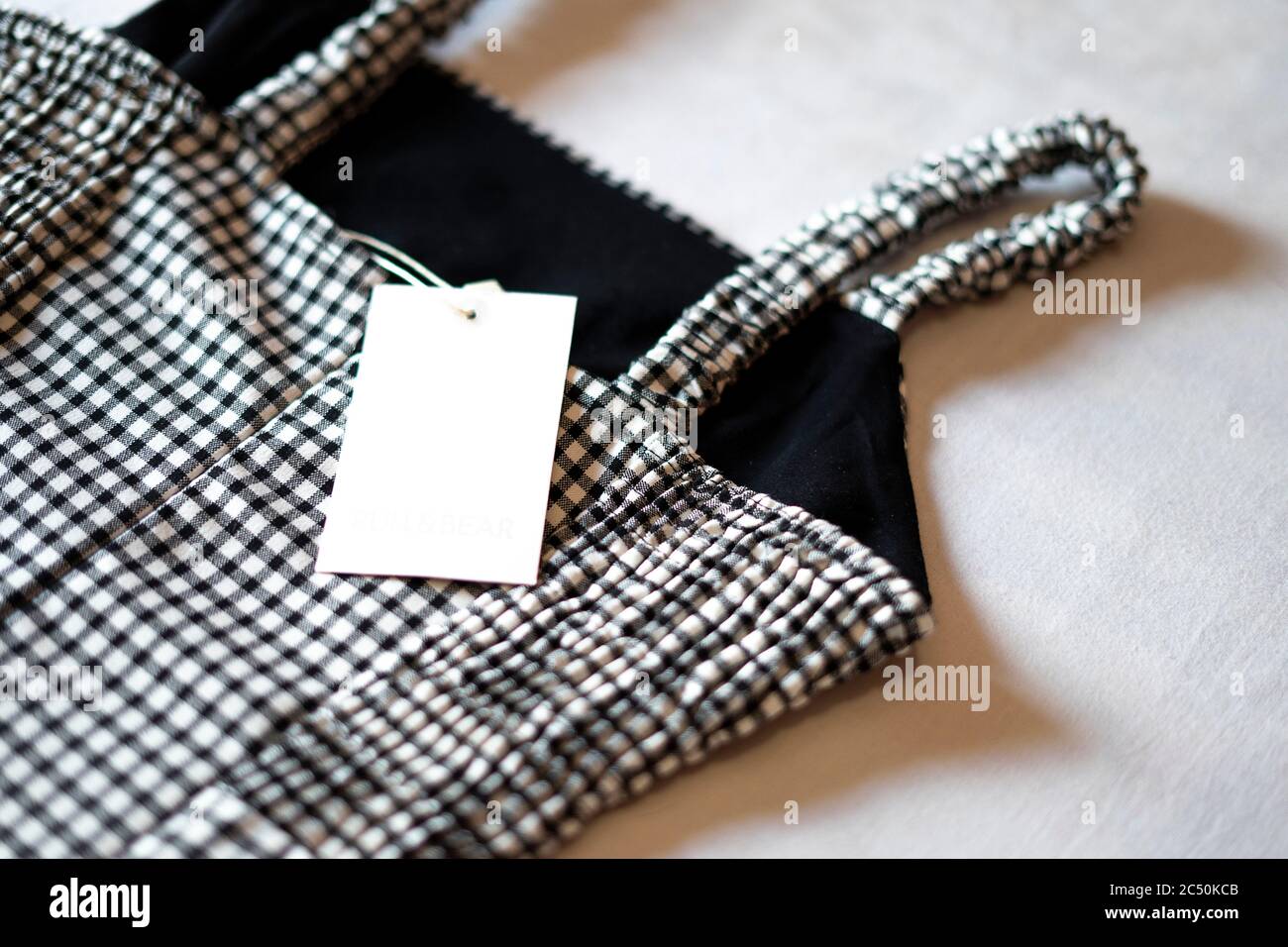 Black and white dress with clothing tag. Clothing label concept Stock ...