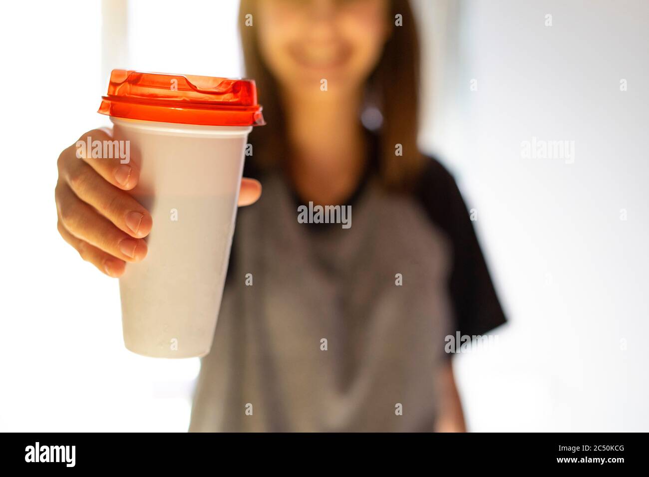 Waitress giving a take away coffee. Takeaway coffee concept Stock Photo ...