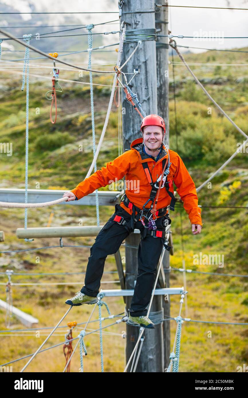 Man balancing on rope hi-res stock photography and images - Alamy