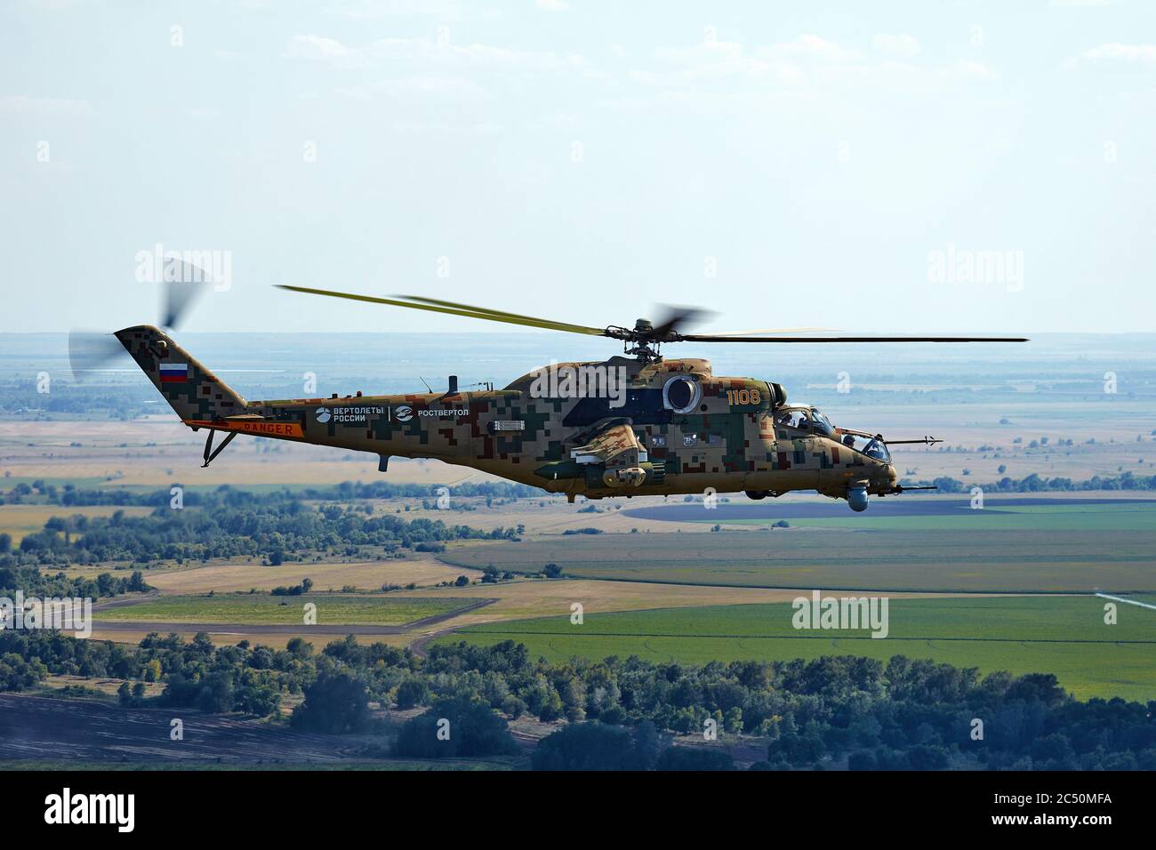 Attack helicopter Mi-35P in flight, view from a parallel helicopter (export version of the Mi-24 ...