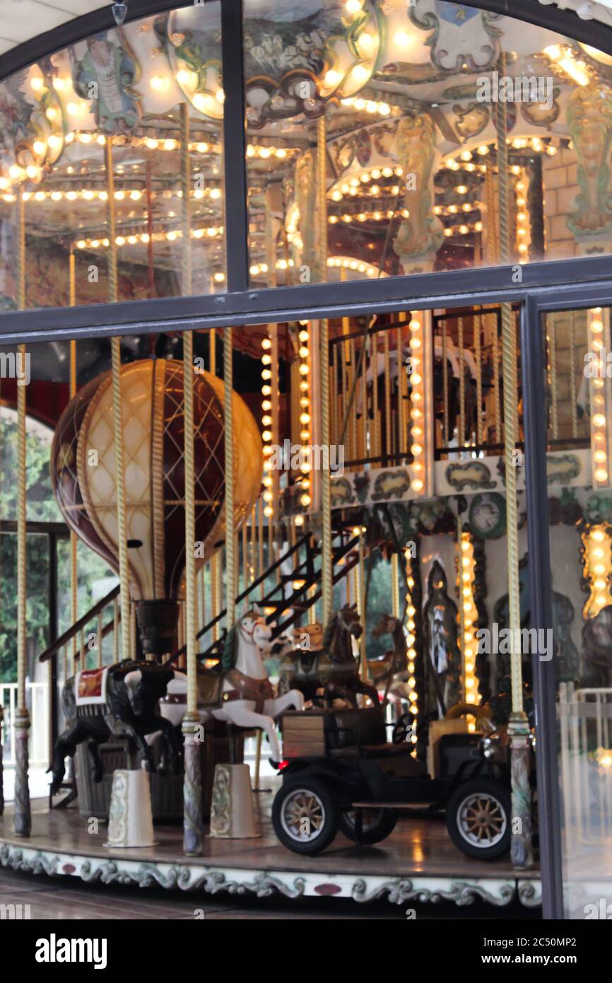 Childrens colorful carousel in a green park in summer weather Stock ...