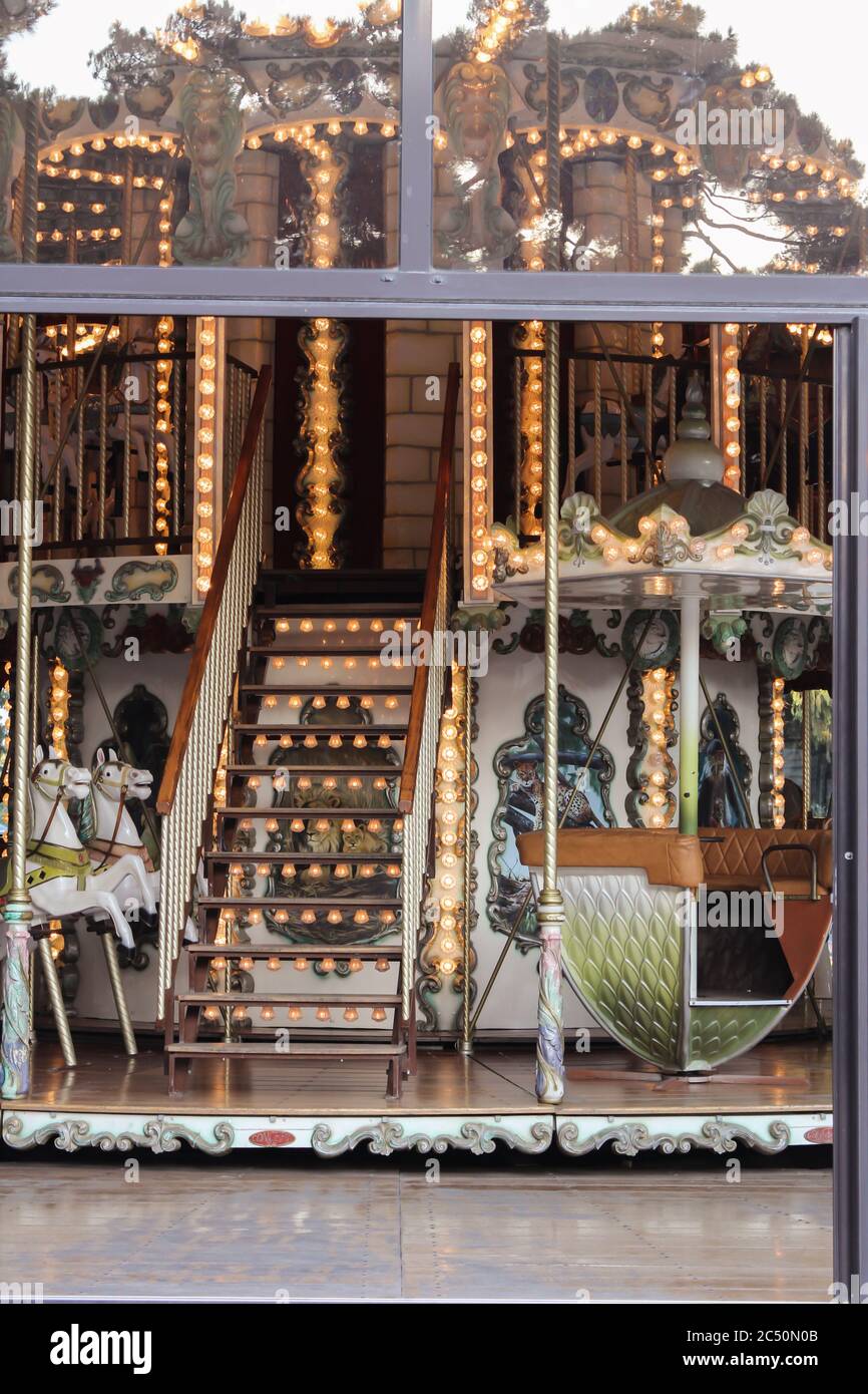 Childrens colorful carousel in a green park in summer weather Stock ...