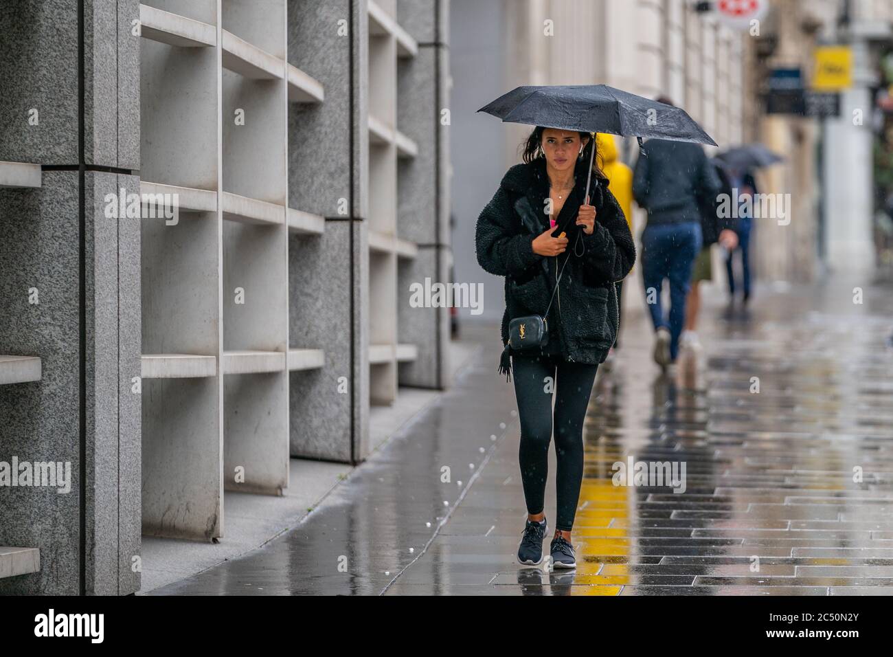 LONDON, ENGLAND - JUNE 10, 2020: Beautiful young woman caught out in ...