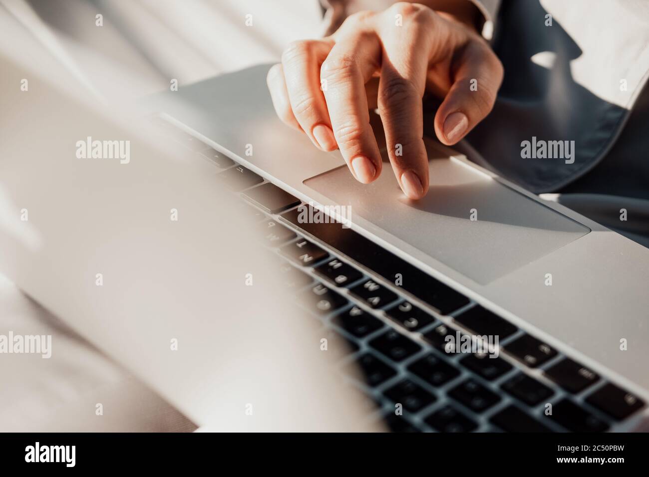 Hand leads on a laptop touchpad close up Stock Photo - Alamy