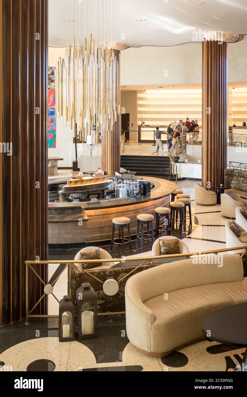 Guests check in beyond the lobby bar of the Nobu Hotel at Eden Roc in ...