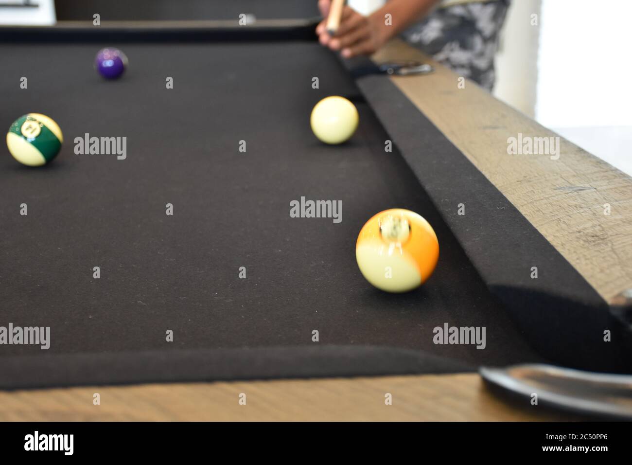 Black billiard table, Playing billiard - Close-up shot of a man playing ...