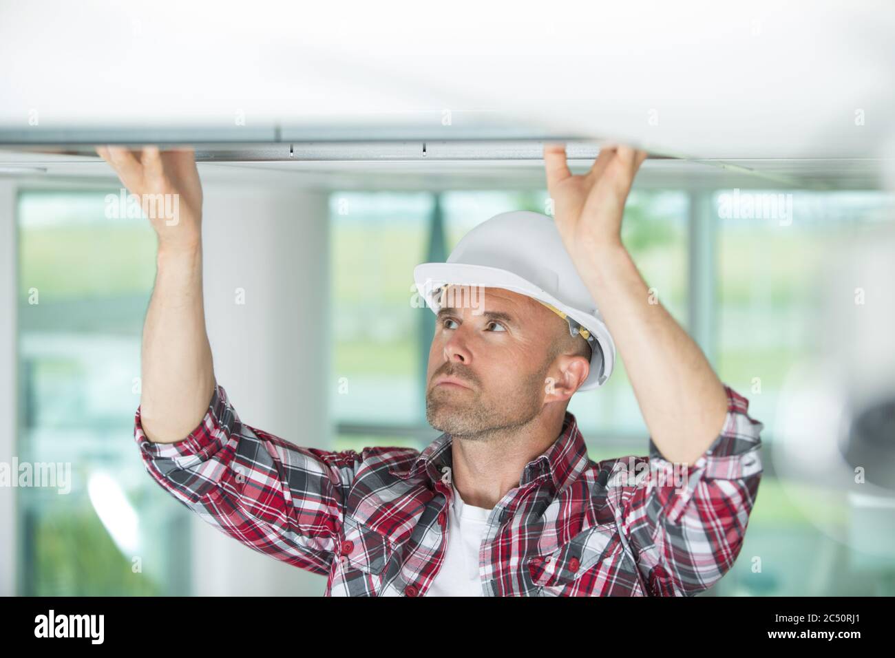 plasterer putting the ceiling Stock Photo - Alamy
