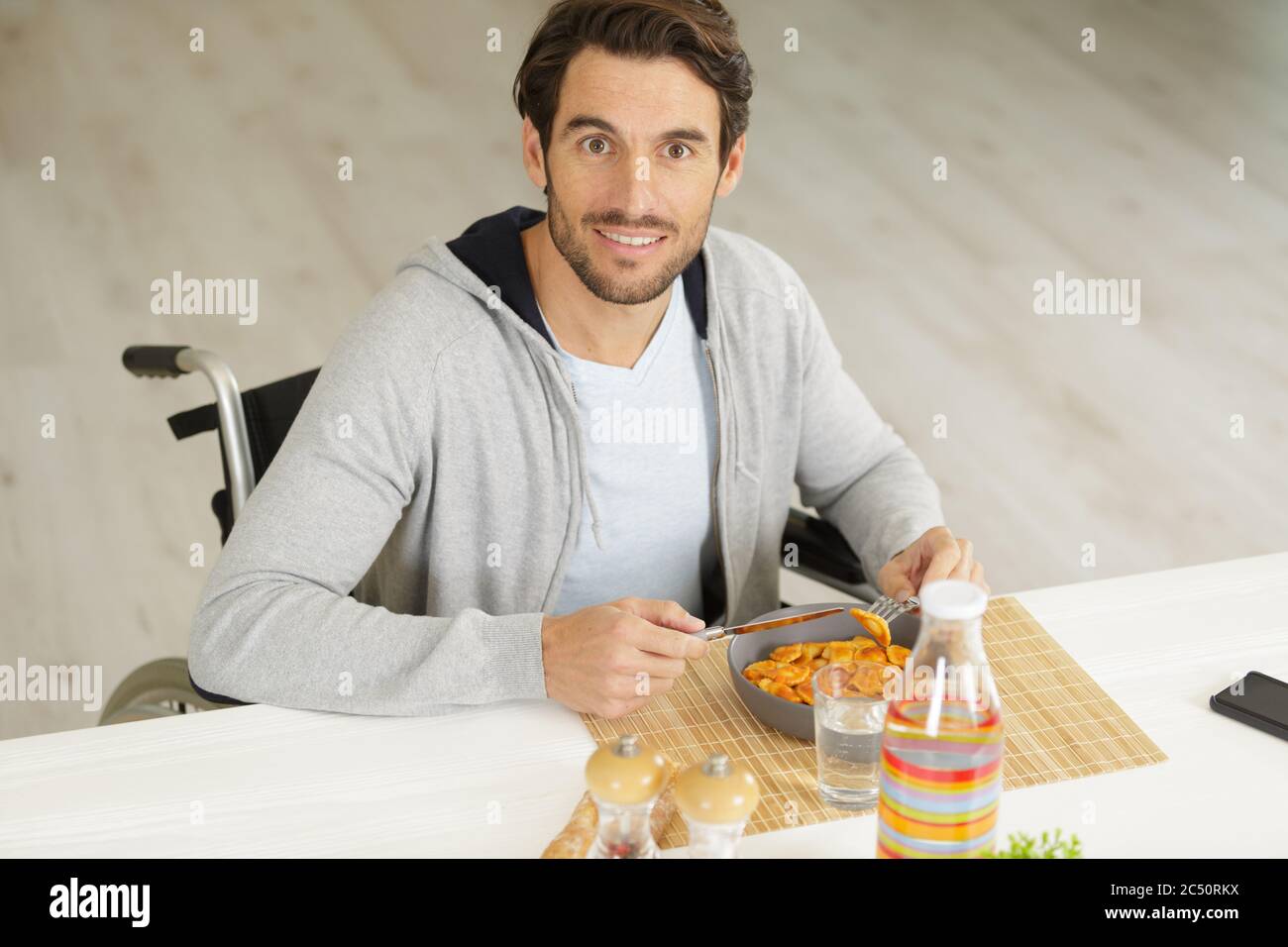 Handicapped man eating hi-res stock photography and images - Alamy