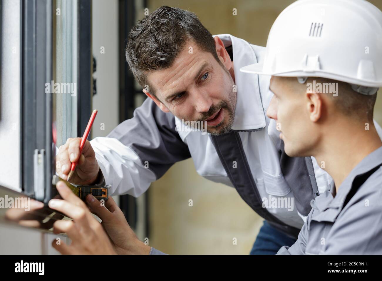 glazing window fitter measuring Stock Photo - Alamy