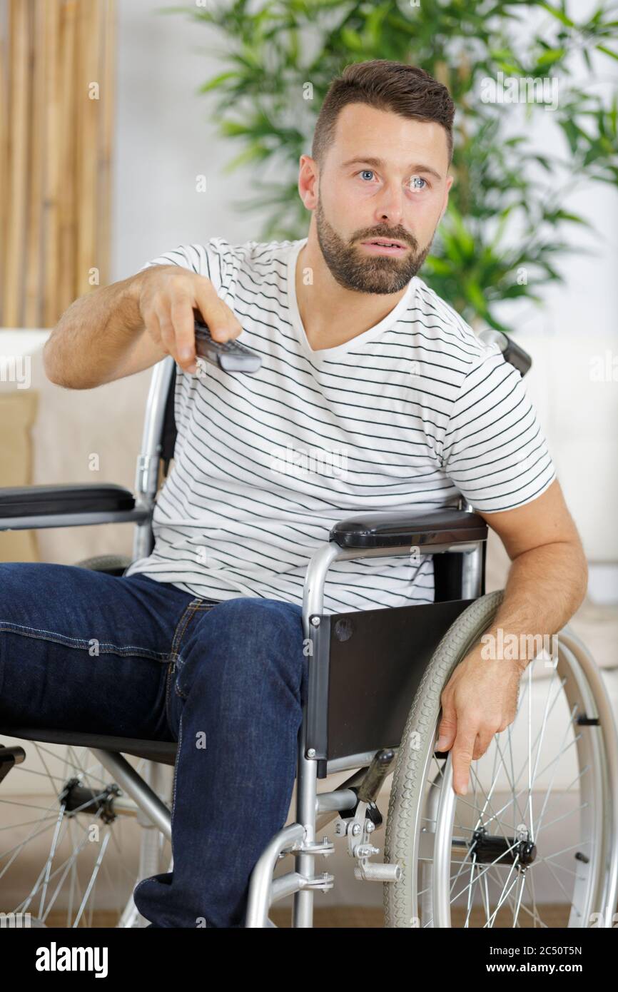 a disabled man watching tv Stock Photo - Alamy