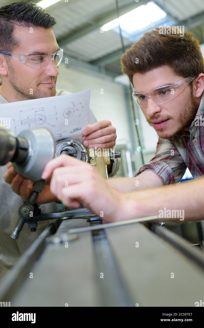 apprentice making mechanical parts design Stock Photo - Alamy