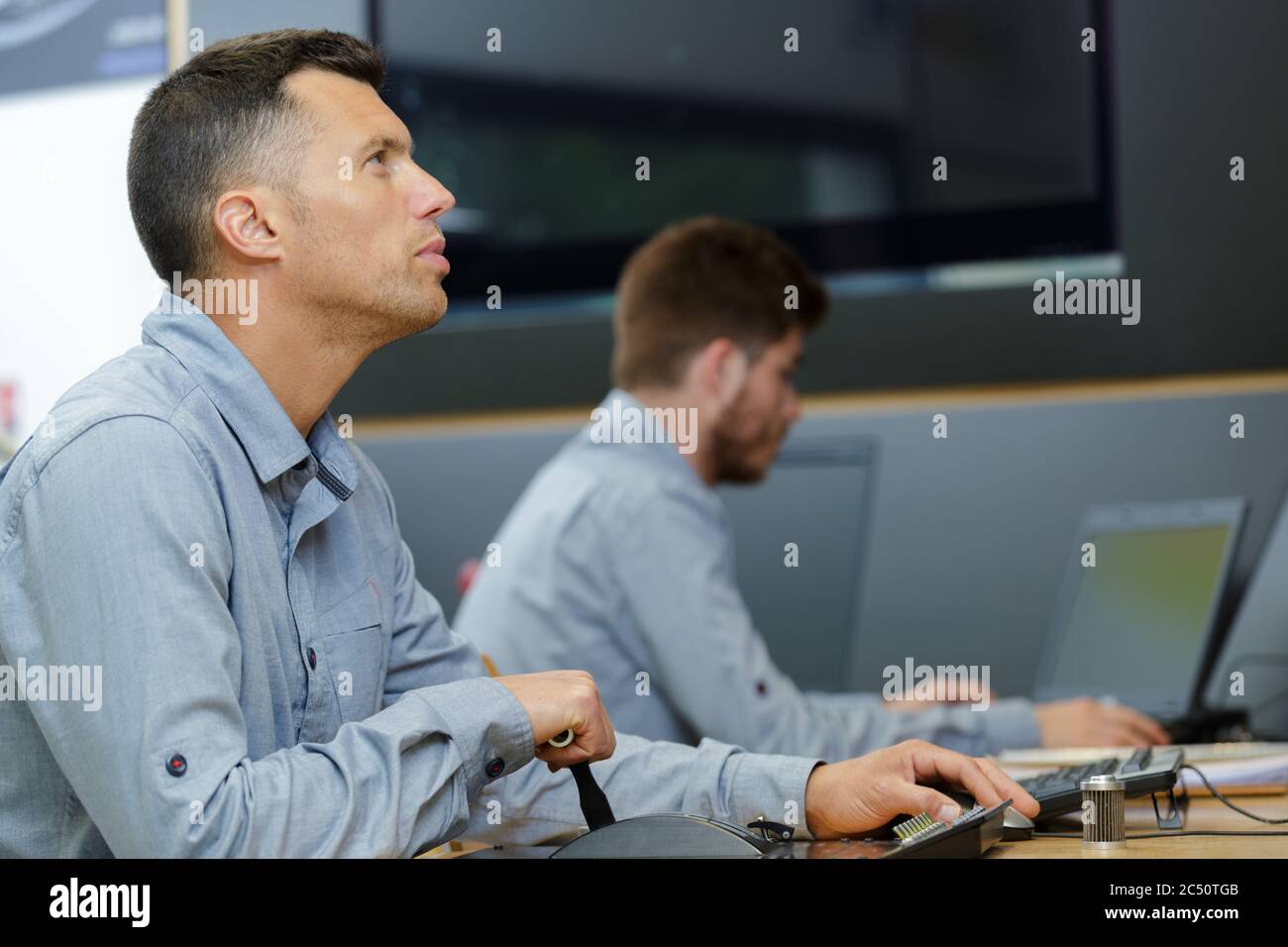portrait of engineers in mechanical office Stock Photo - Alamy