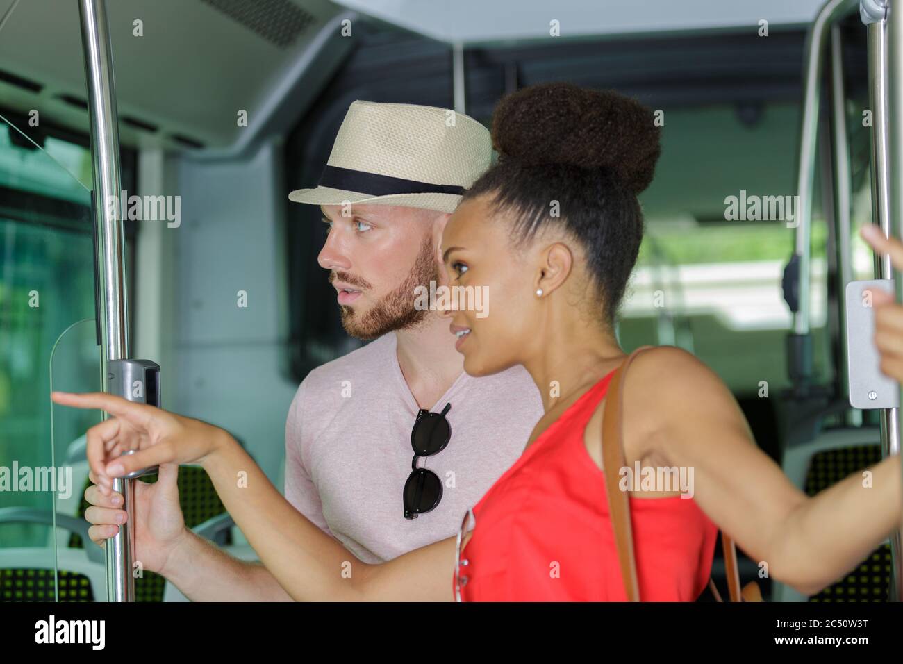 girlfriend inside the bus pointing Stock Photo - Alamy