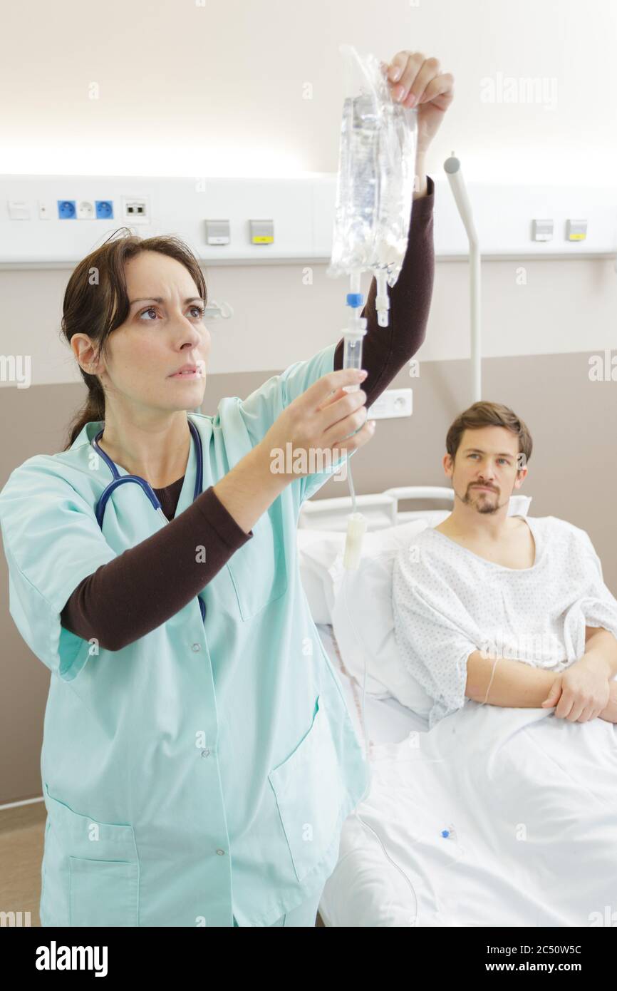 Nurse preparing infusion bag hi-res stock photography and images - Alamy