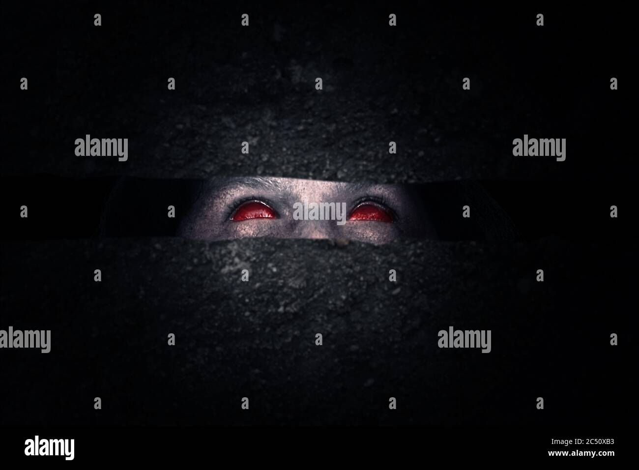 Scary zombie hiding behind the wall with dark background Stock Photo ...