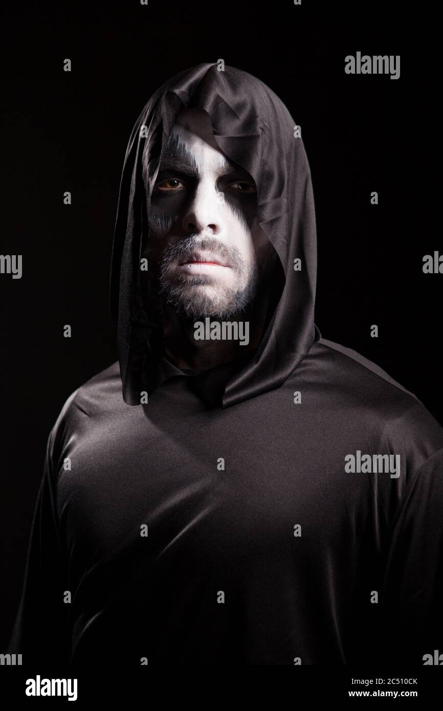 Creepy man dressed up like grim reaper for halloween Stock Photo - Alamy