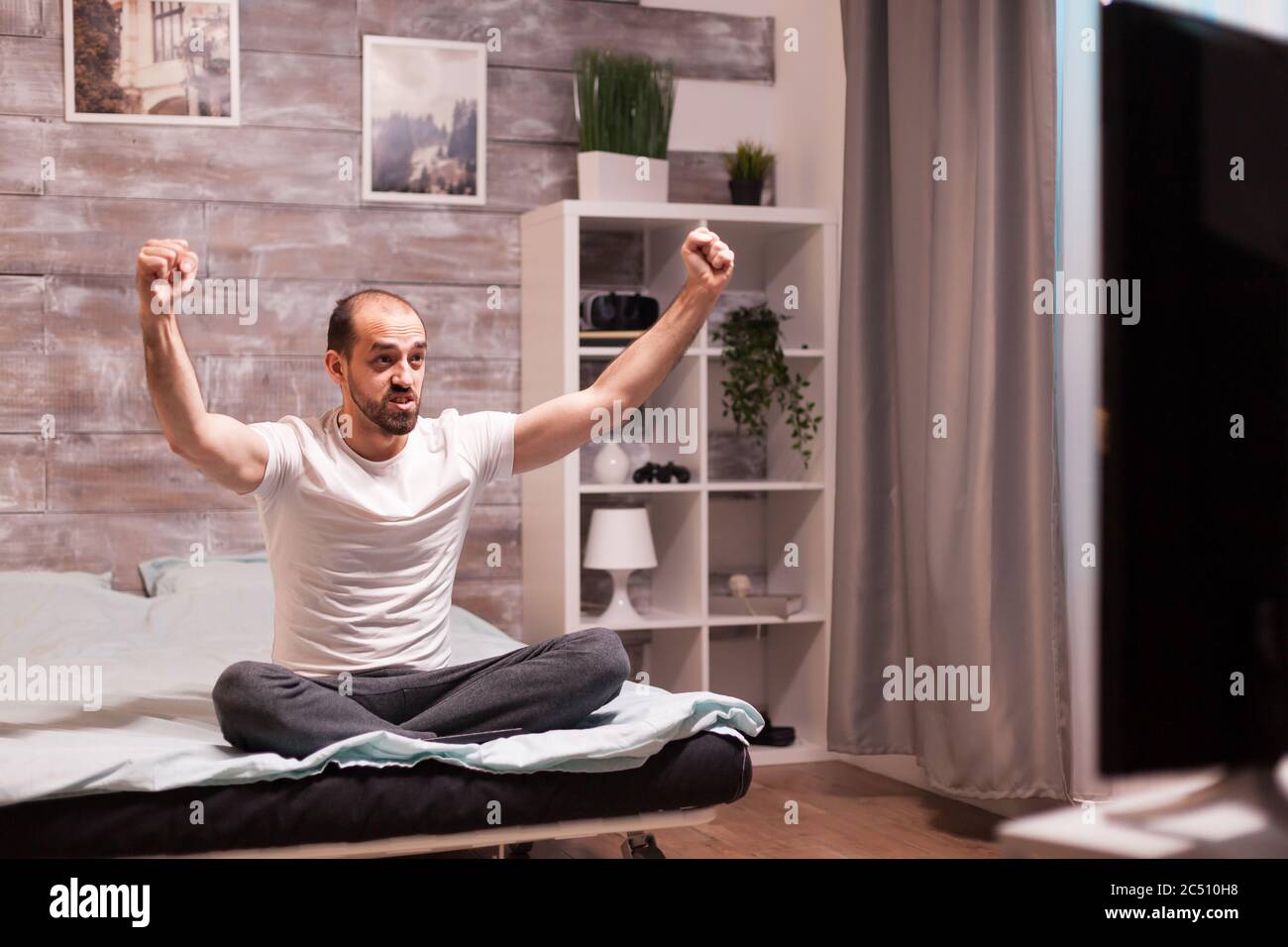 Watching big screen tv hi-res stock photography and images - Alamy