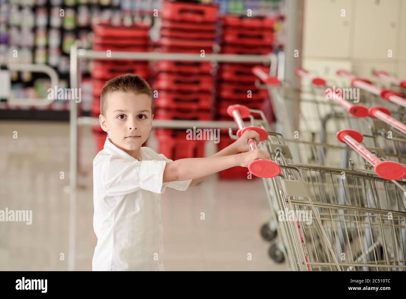 boy in a large shopping center Stock Photo - Alamy