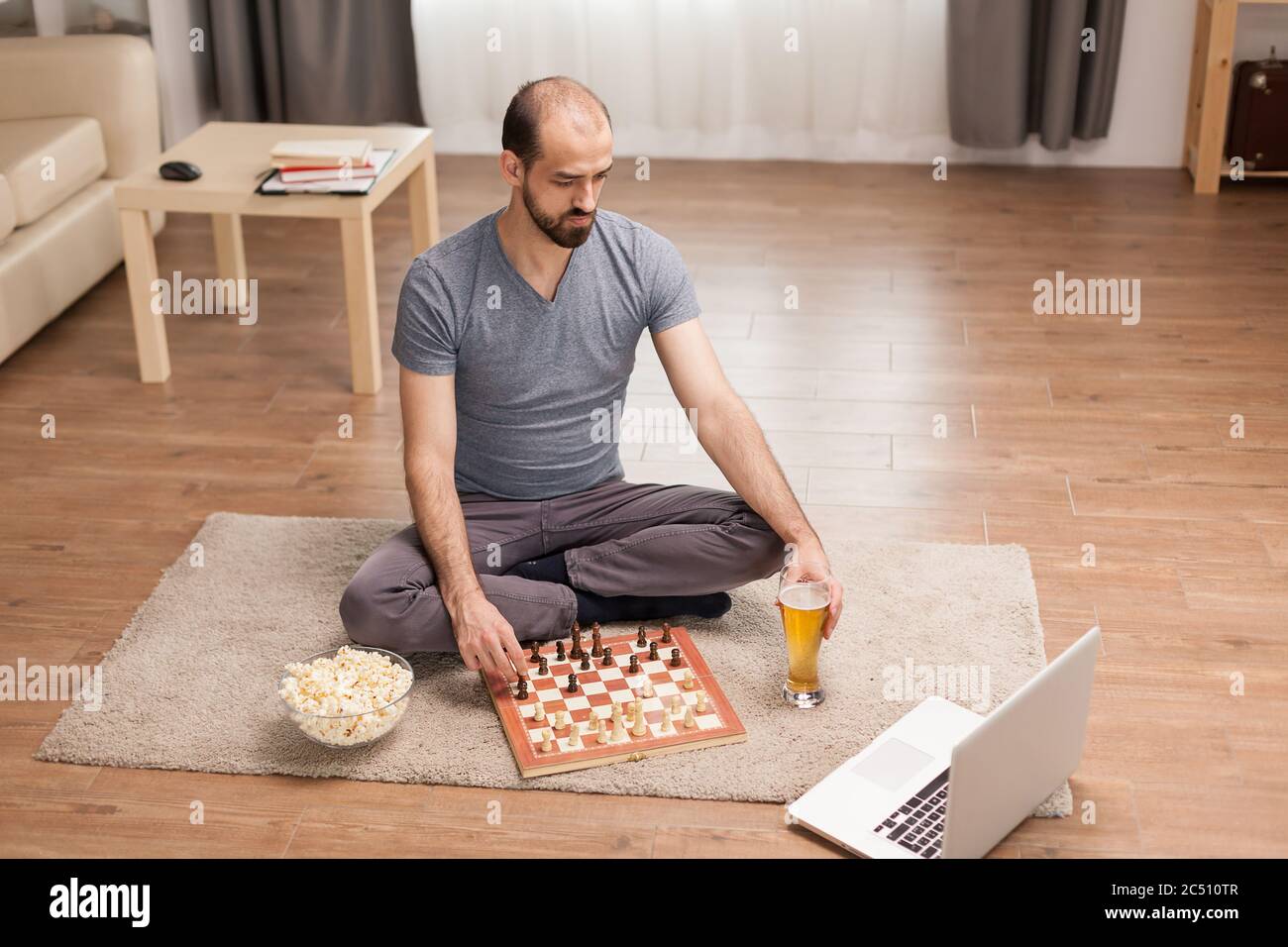 Man learning chess from his friend on video call during covid-19 Stock ...