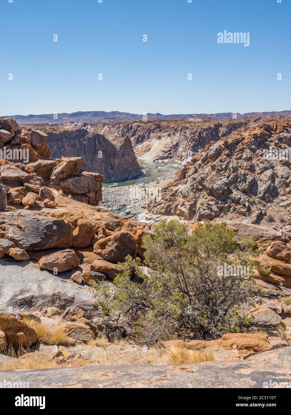 A tree overlooks the Orange River Gorge below the waterfall in the ...