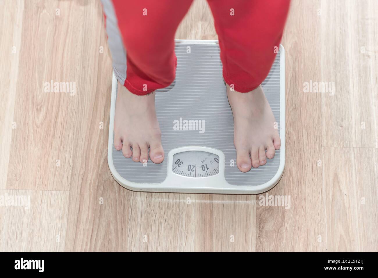 obesity in humans, weight measurement Stock Photo - Alamy