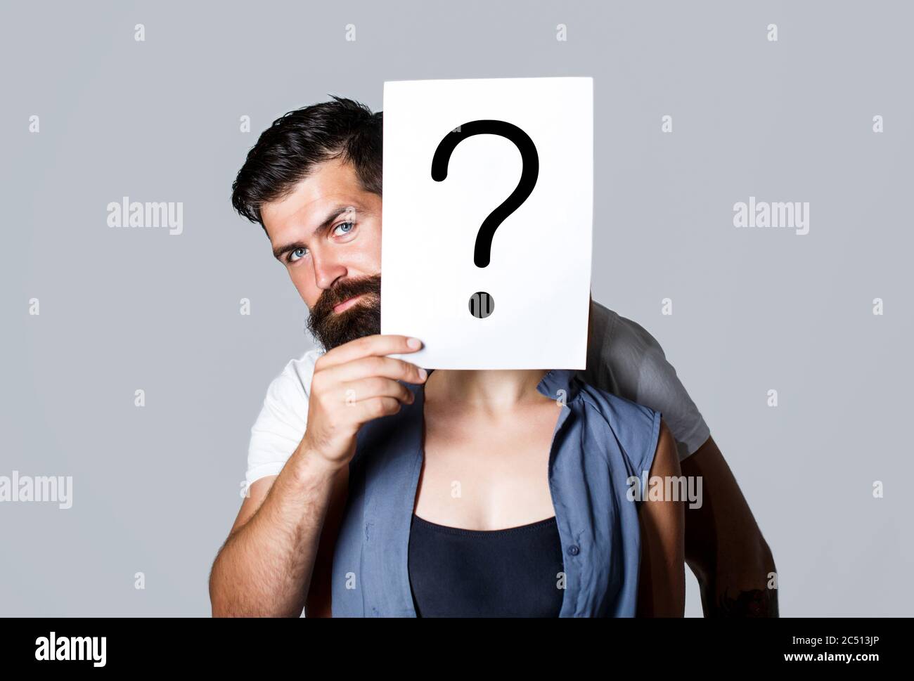 Anonymous girl, peeking behind of interrogation symbol. Woman incognita ...