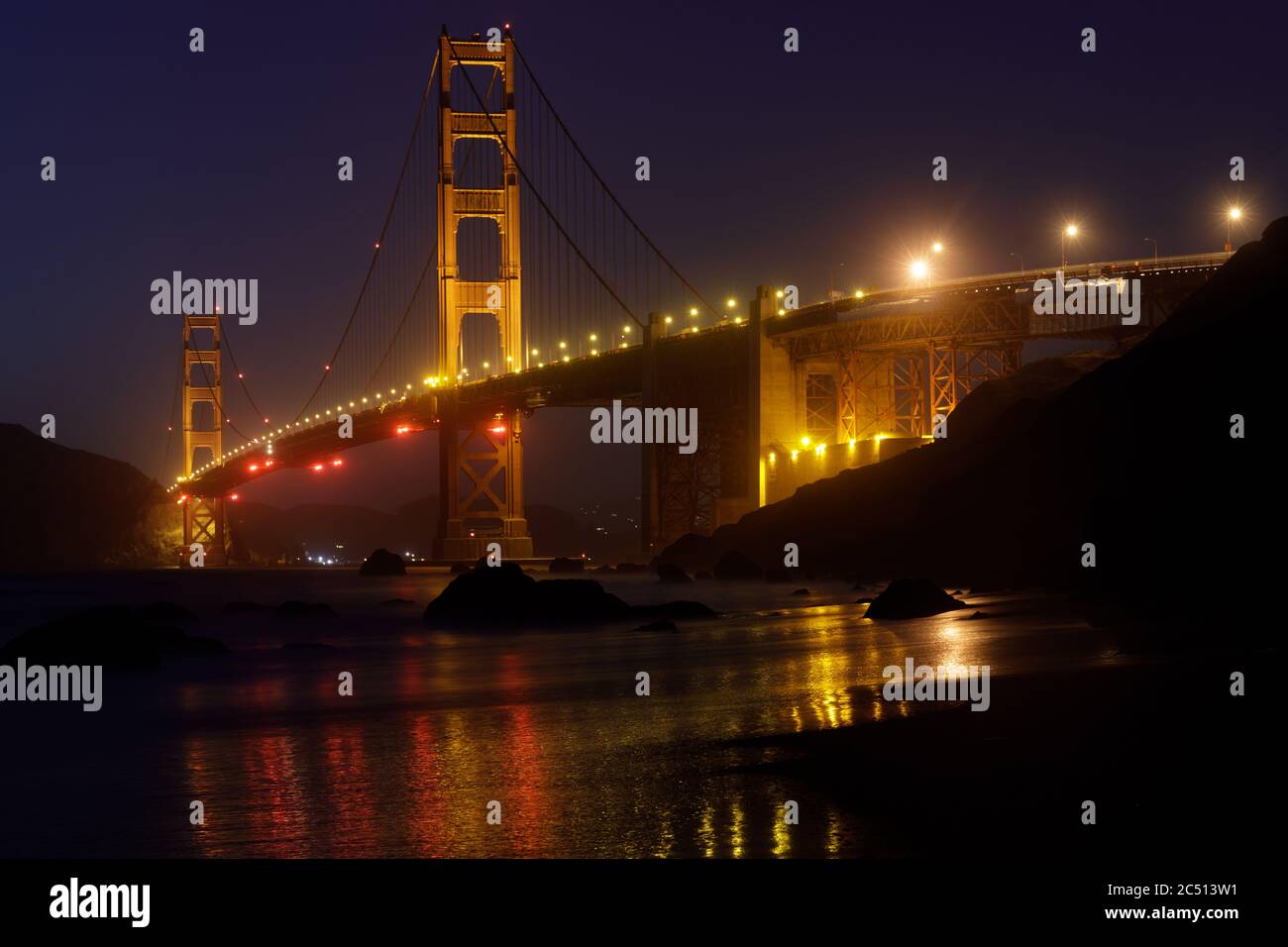 Golden Gate Bridge and Reflections Glow in the Dar Stock Photo - Alamy