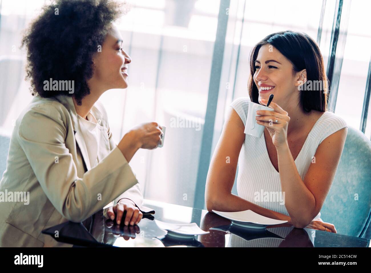 Chatting in cafe hi-res stock photography and images - Alamy