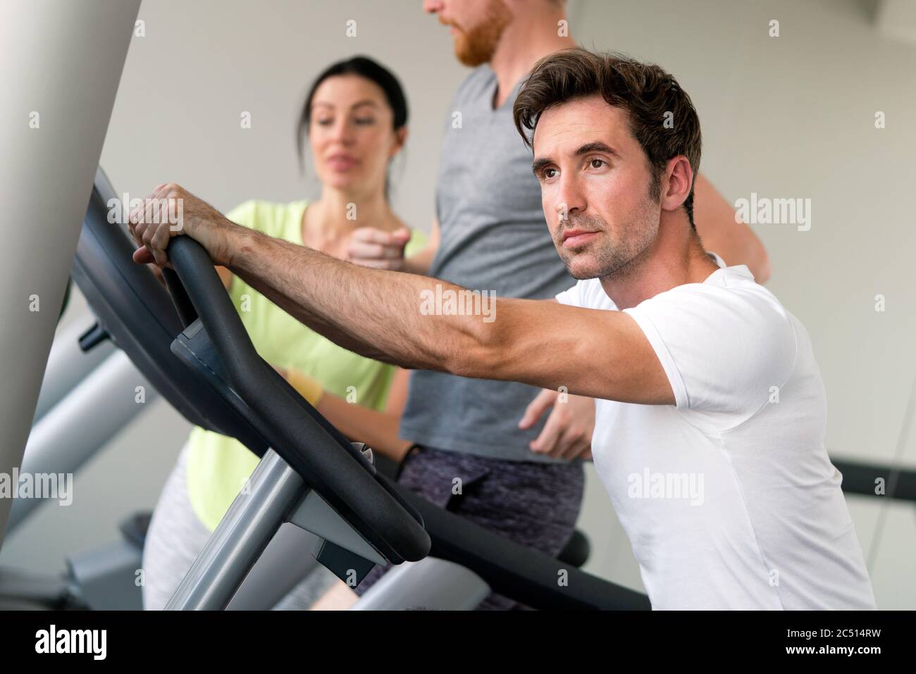 Fit people working out at the gym Stock Photo - Alamy