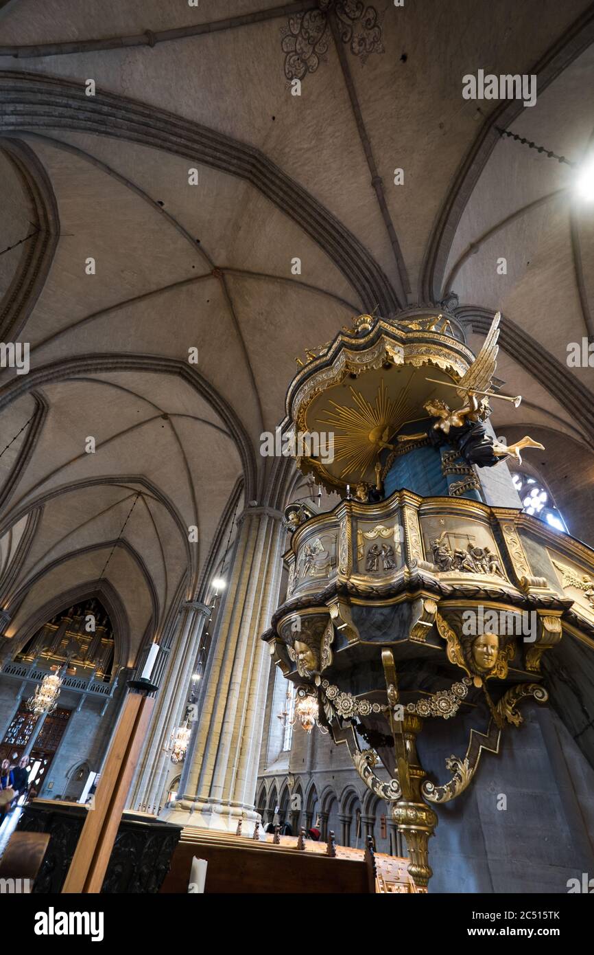 Interior of the Cathedral with the richly decorated and gilded pulpit ...
