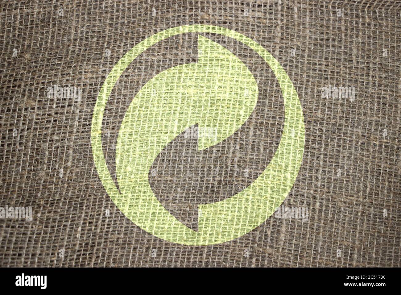 Recycle symbol on rough textile fabric. Concept of environment ...