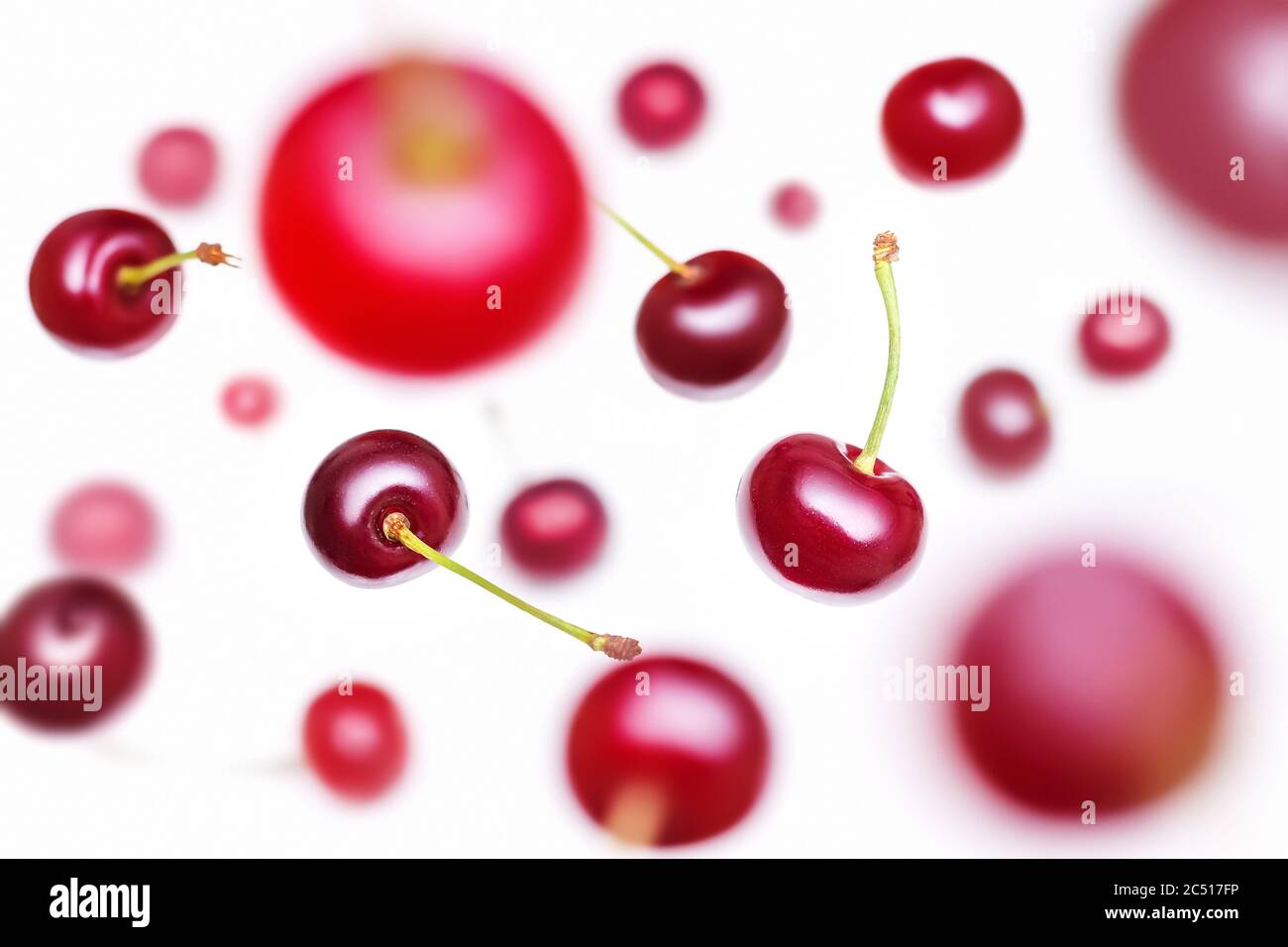 Flying cherry. Several berries of falling cherry with shallow depth of ...