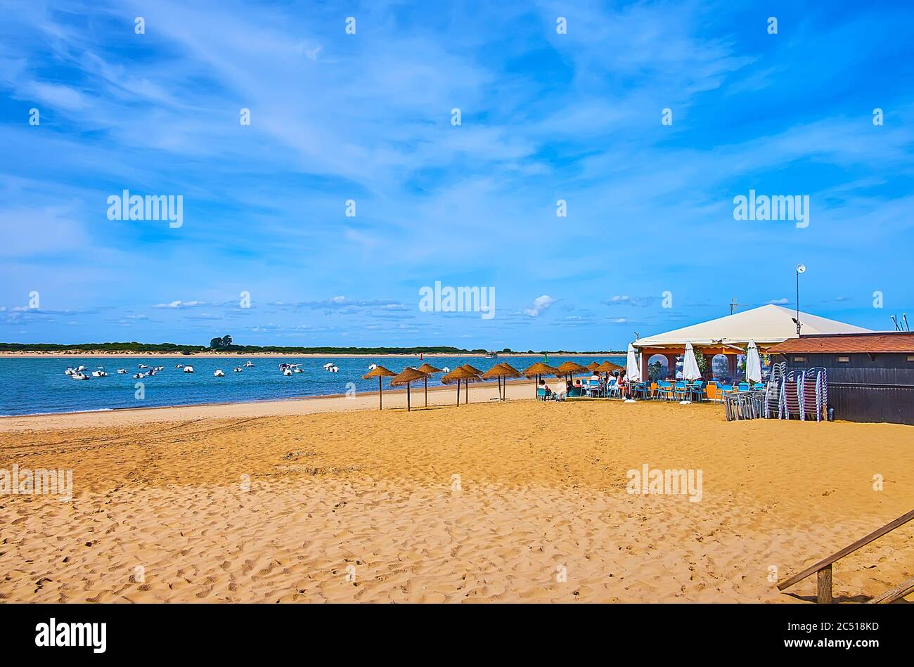 Las Piletas beach on Guadalquivir river with summer terrace of beach ...