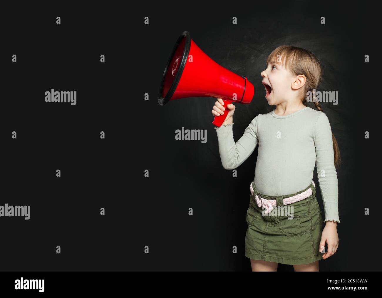 Kid shouting through megaphone hi-res stock photography and images - Alamy
