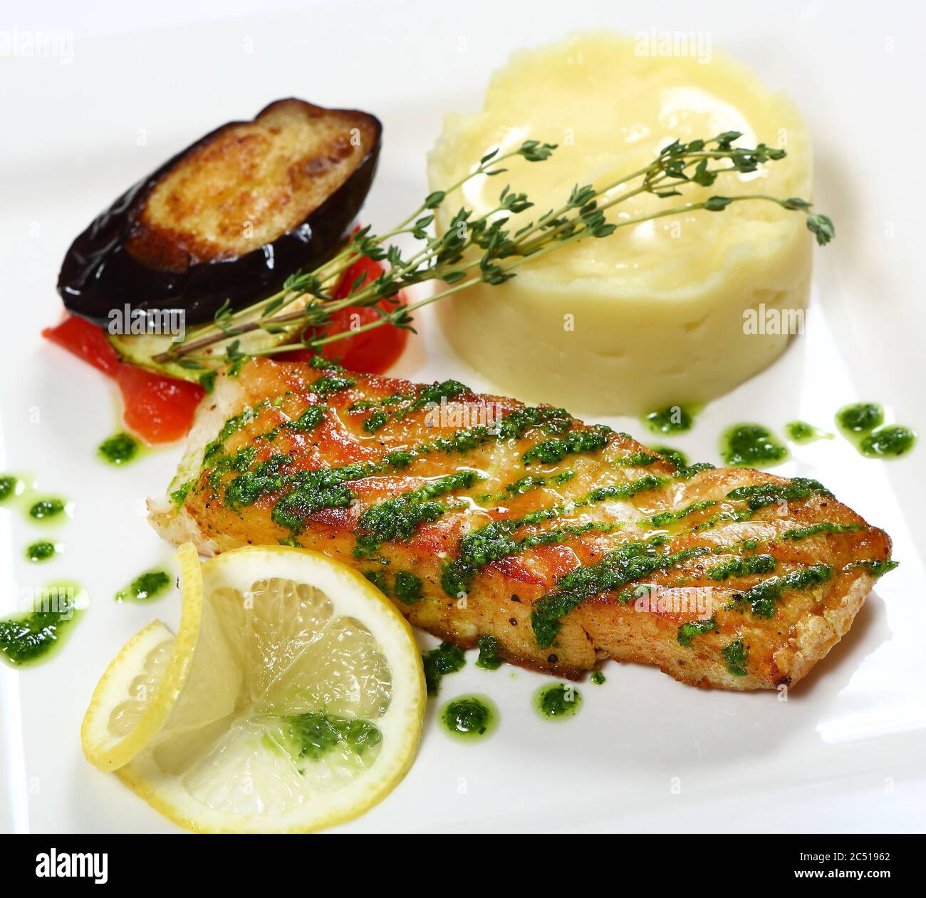 Cod steak. Cod fillet with breaded pesto sauce, mashed potatoes and ...