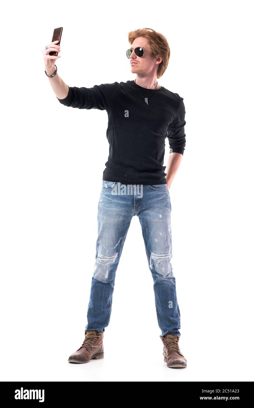 Confident handsome young authentic man taking selfie photos with smart ...