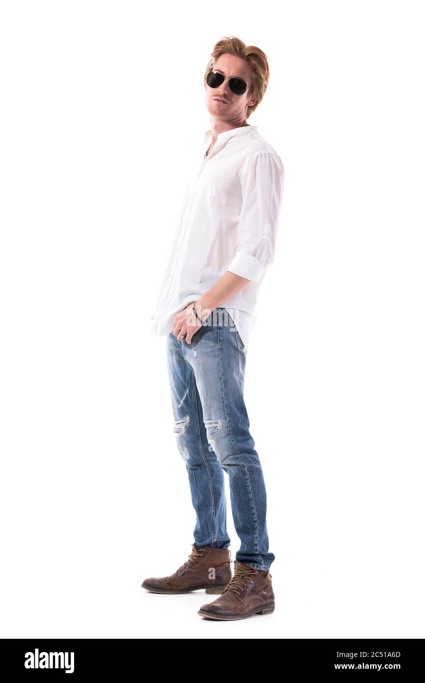 Handsome stylish confident young ginger man fashion model standing with ...