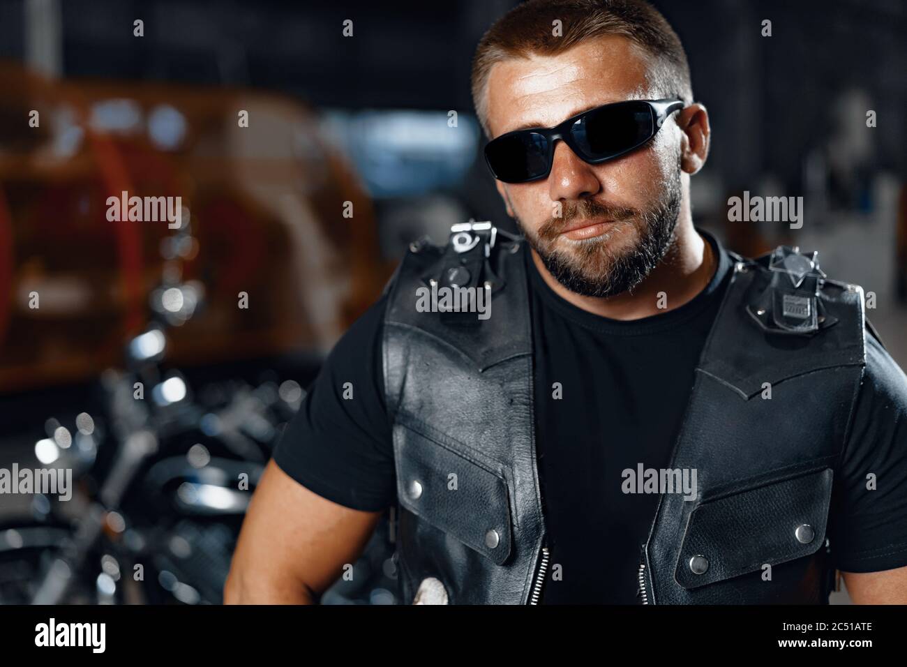 Portrait of motorbike rider in black leather outfit Stock Photo - Alamy