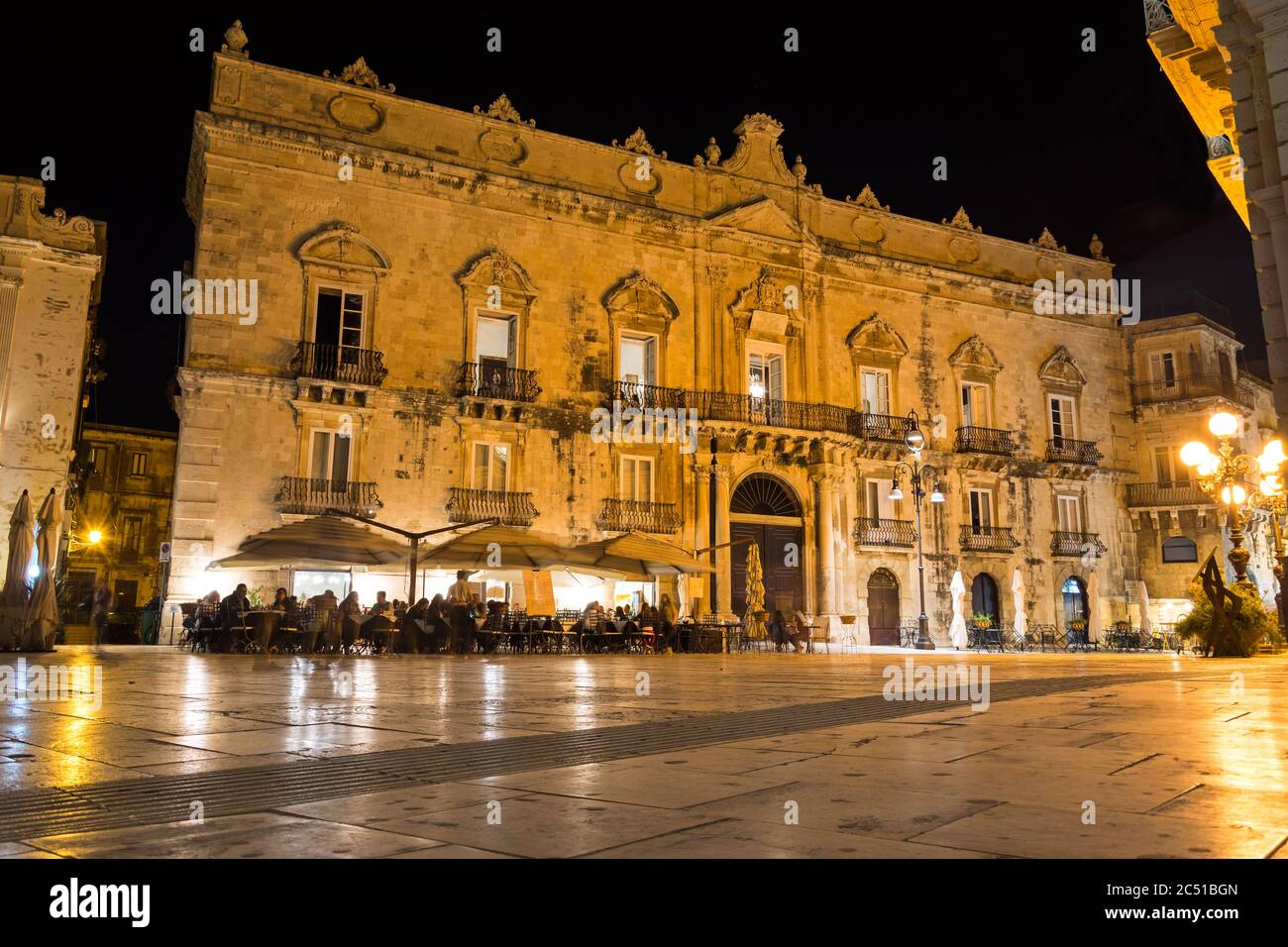 Night shot of square and baroque building in beautiful ancient Italian ...
