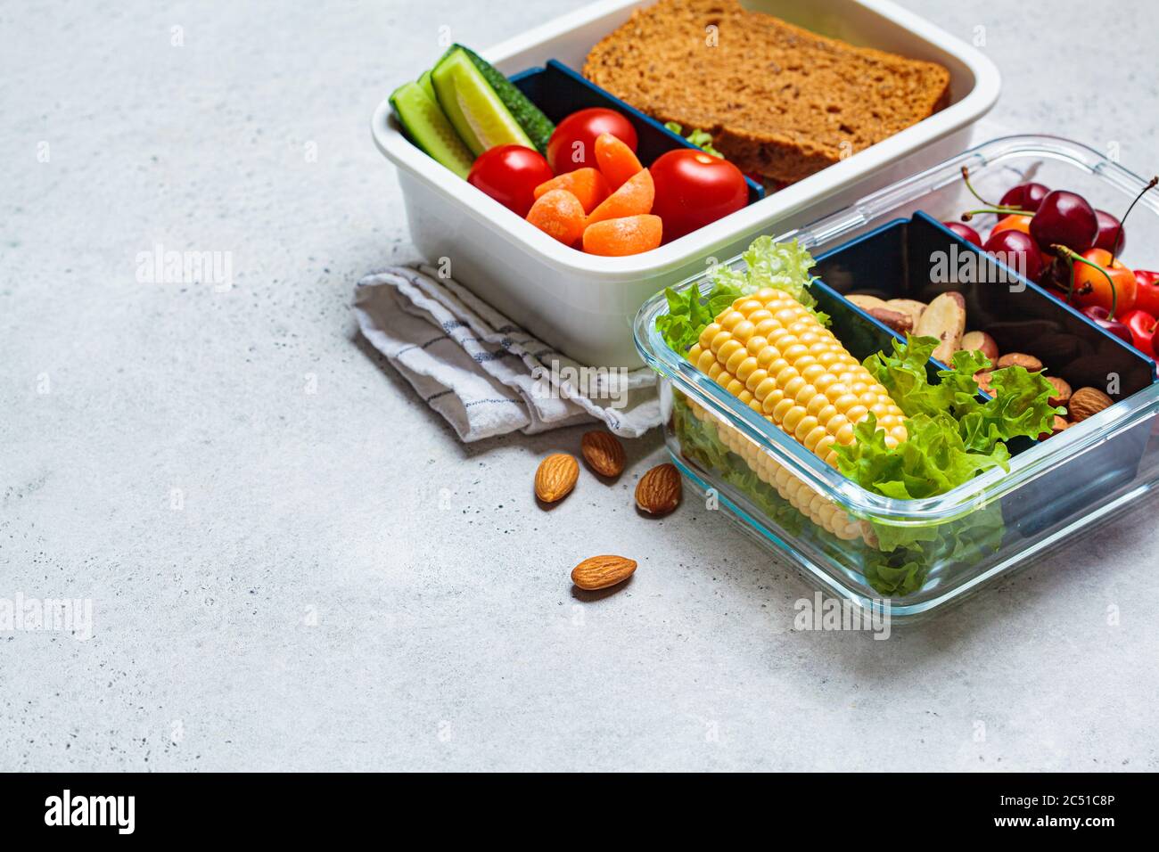 Lunch box with healthy fresh food. Sandwich, vegetables, fruits and ...
