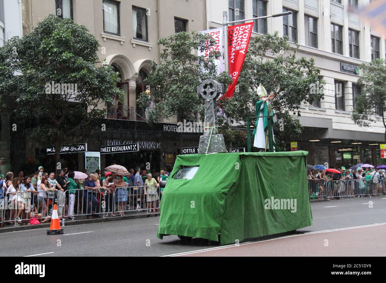St Patrick passes by on a float in the pouring rain in the St Patrick’s ...