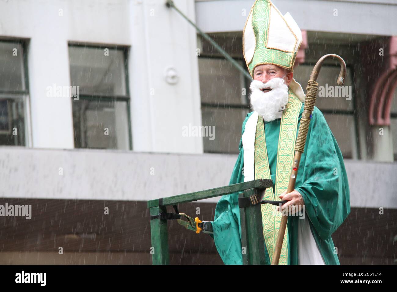 St Patrick passes by on a float in the pouring rain in the St Patrick’s ...