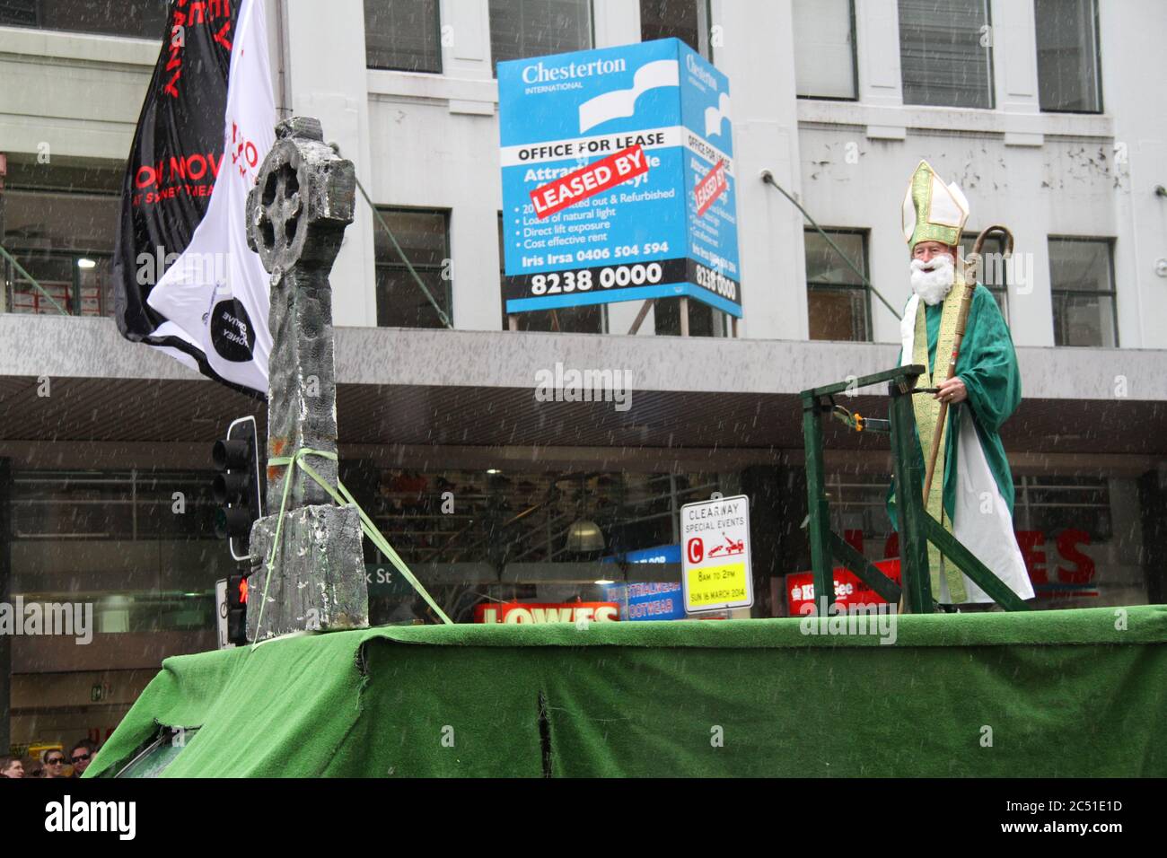 St Patrick passes by on a float in the pouring rain in the St Patrick’s ...