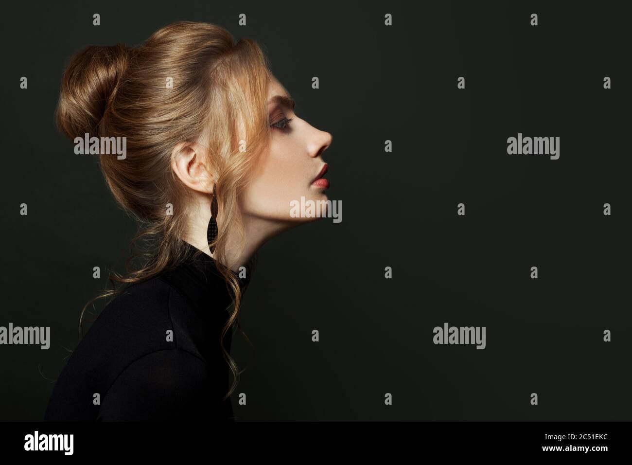Attractive model girl on black background Stock Photo - Alamy