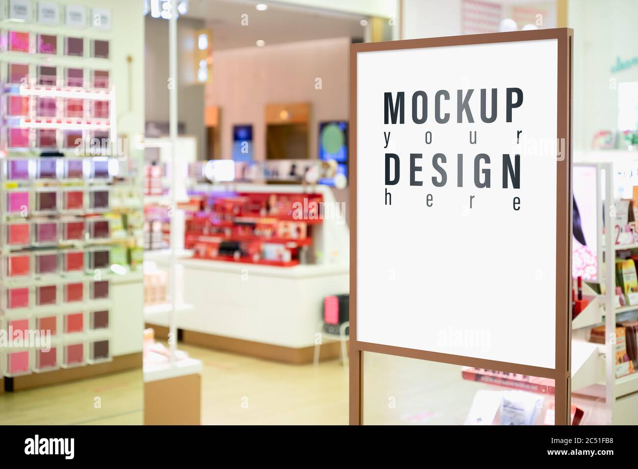 Mock up of vertical poster billboard with blurred cosmetic shop ...